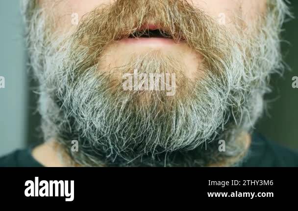 A man with a beard speaks quickly. A sick man in a mental hospital with ...