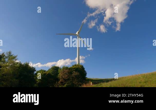 An ecological source of energy. Windmill on a mountain in Munich. Wind ...