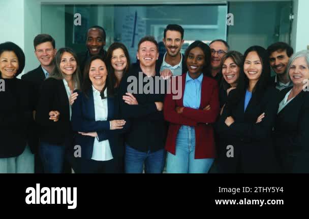 Group of multigenerational business team standing in front of camera ...