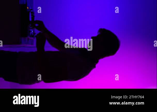 Silhouette of man, professional dj making sounds at night club party ...