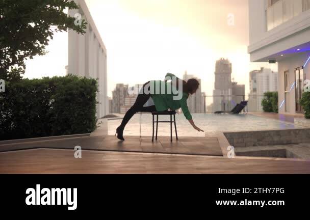 Kneeling on chair Stock Videos & Footage - HD and 4K Video Clips - Alamy