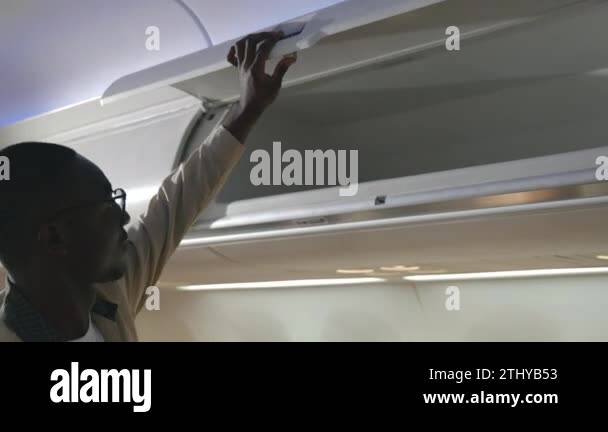 Plane overhead locker Stock Videos & Footage - HD and 4K Video Clips ...