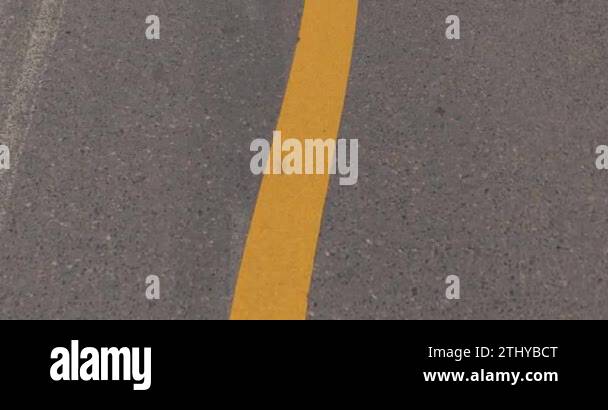 Rough line in an urban environment. Close up. Curved road markings ...