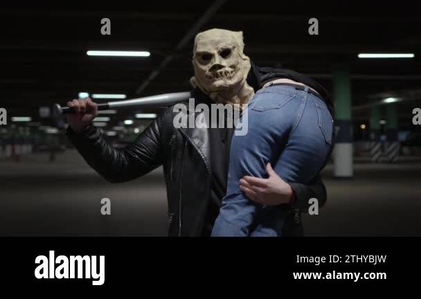 Homicidal maniac on Halloween or Doomsday. Male killer in scary ...