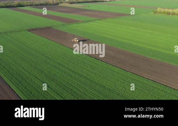 Above rotation view, orbit dolly move, of tractor as pulling mechanical ...