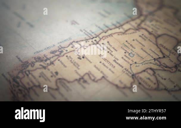 Argentina on a vintage political world map. Slow motion, tracking arc ...
