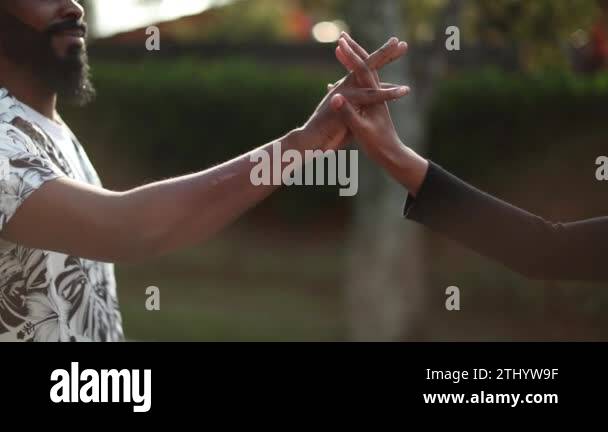 Two people joining hands together in teamwork, couple alliance hand ...