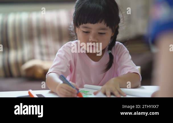 Cute little child painting with colorful paints. Asian girl and her ...