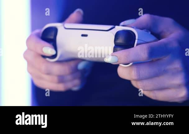 Odesa, Ukraine - April, 2023. Gamer's hands playing online video game on PlayStation 5 PS5 ...