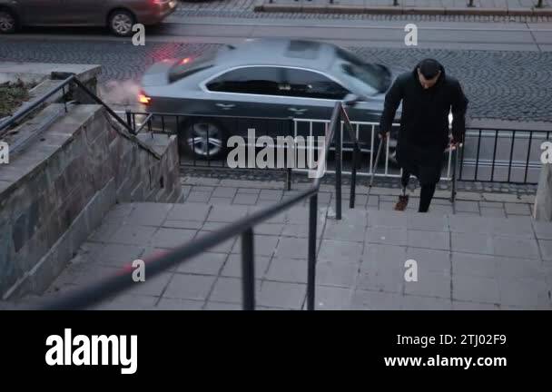 Struggle climb, Disabled movement, Stair therapy. Man with prosthetic ...