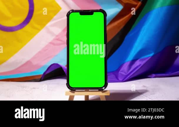 Zoom in out Mobile phone with chroma key on Rainbow LGBTQIA flag made ...