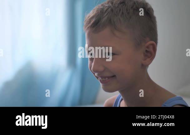 face profile of talking smiling teenager looking down. Side view ...