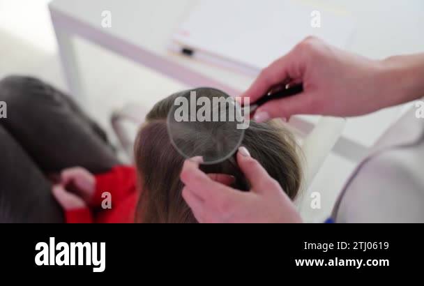 Checking for lice Stock Videos & Footage - HD and 4K Video Clips - Alamy