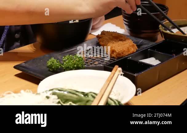 The motion of people eating food with family inside a Japanese ...