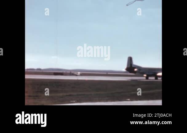 Cold War era USAF freighter aircraft on the runway waiting for takeoff ...