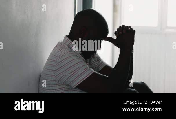 Troubled African man suffering from depression. Black guy feeling ...