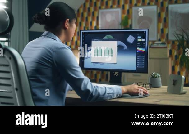 Female designer creating 3D visualization of clothes using computer and ...