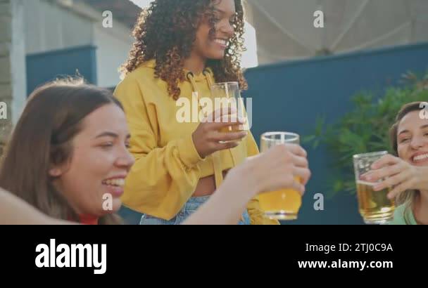 Group of friends celebrating toasting with drinks. Diverse people toast ...
