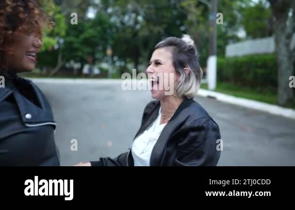 Two friends real life laugh and smile, authentic genuine bonding moment ...