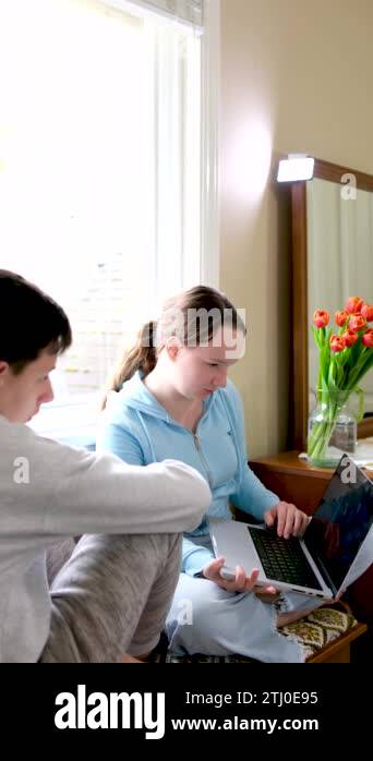 explain lesson boy showing girl on computer helping study friends older ...
