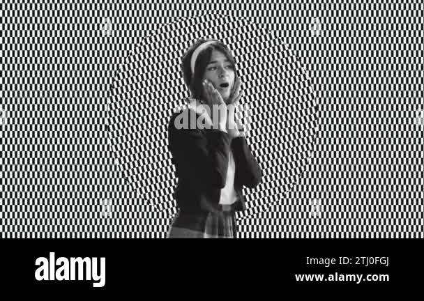 Shock, surprise, wow. Young surprised woman on black and white optical ...