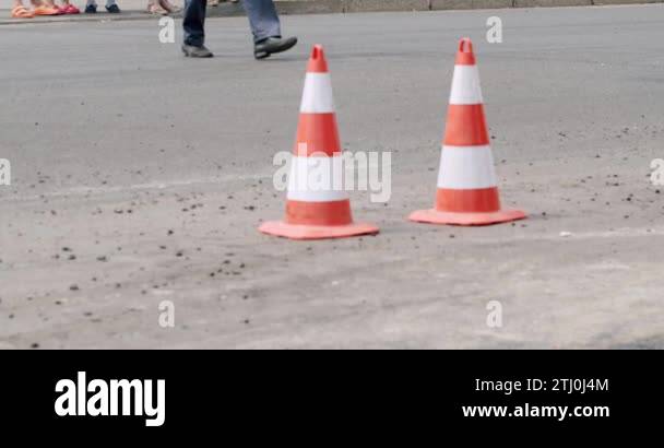 Road maintenance work cone static closeup. Roadworks signs on a street ...