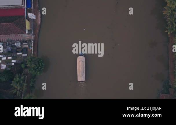 Houseboat tour of Kerala backwaters at Alleppey, India. Aerial top down ...
