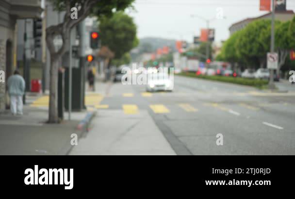 Daytime shot of typical traffic on an urban street. Out of focus ...