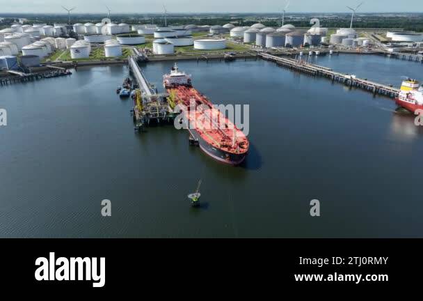Liquid Cargo Transporter Ship Unloading Crude Oil to a Fuel Depot Stock ...