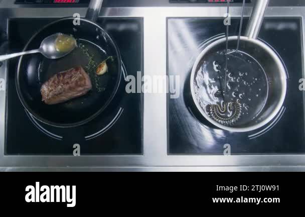 Close up shot of cook putting frying pan on electric stove and pouring ...