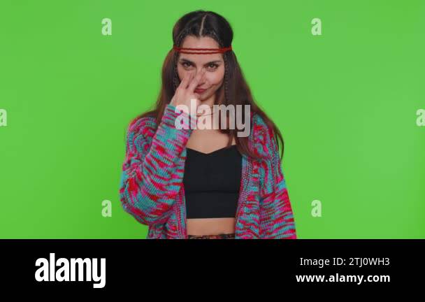 I am watching you. Young confident woman pointing at her eyes and ...