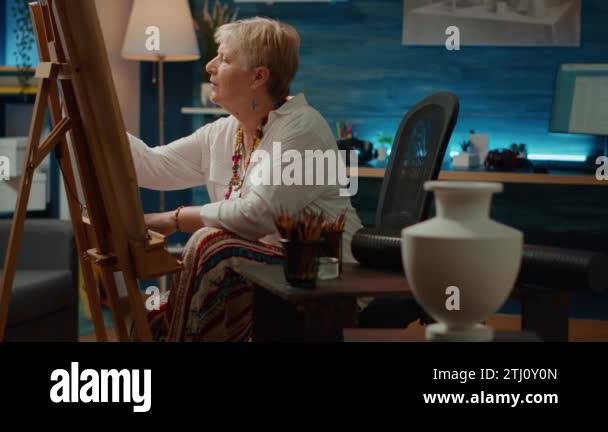 Old artist using artistic skills and tools to create authentic drawing ...