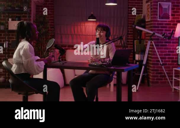 Online radio host doing high five hand gesture with african american ...