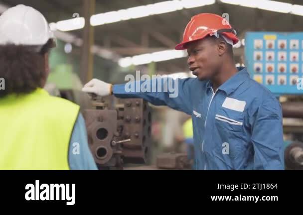 Factory Professional African and Asian worker and manager inspector on ...