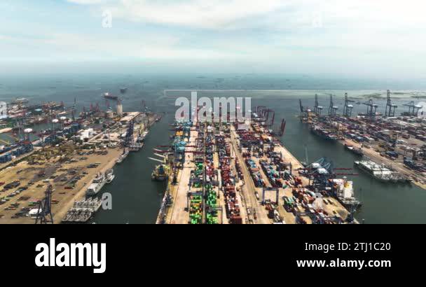 Sea port with container ships and cranes in the loading area. Tanjung ...