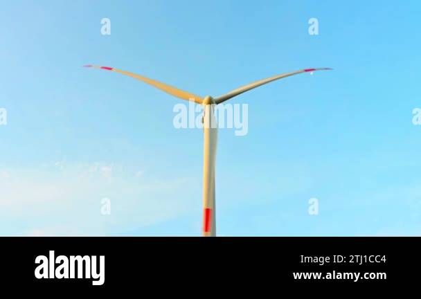 Wind turbine in an offshore wind farm in the green field against low ...