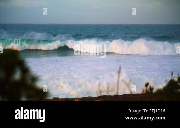 Powerful white waves rolling towards tropical coastline. Foamy ocean ...