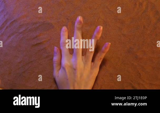 Hand drawing Serious Smile symbol in the sand. Beach background. Top ...