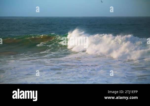 Powerful waves rolling surface creating foam. Massive stormy sea water ...