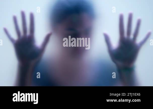 Woman behind matte glass blurry hand and body depression concept Stock ...