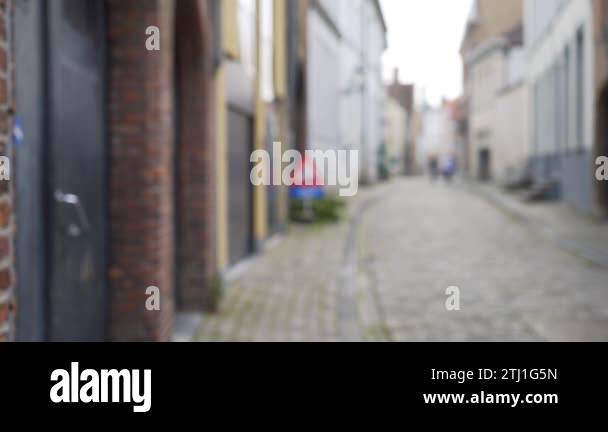 Out of focus background plate of European cobblestone street in Bruges ...