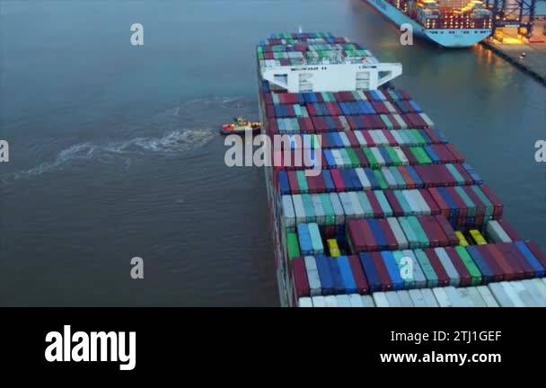Container ship loading and in deep sea port, Aerial view of business ...