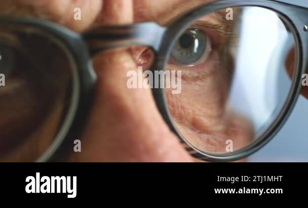 Senior man, glasses and poor eyesight of elderly male putting on ...