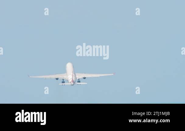 Passenger jet plane fly away, rear view. Jet plane in the sky. Flight ...