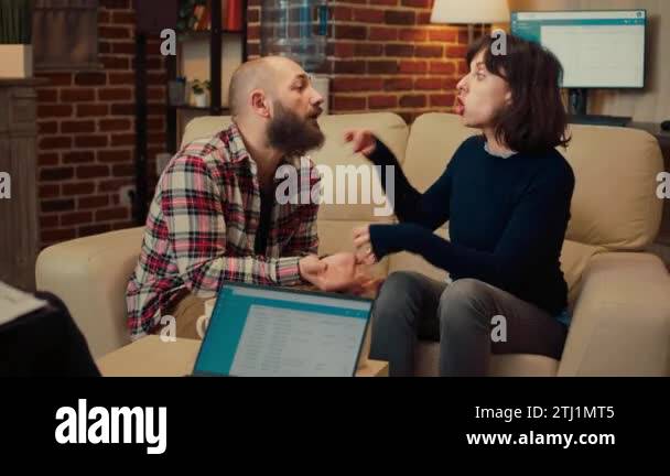 Psychologist listening to people fighting at couple therapy session ...