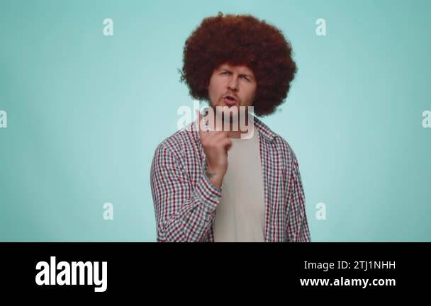 Displeased man shakes finger and saying no, be careful, scolding and ...