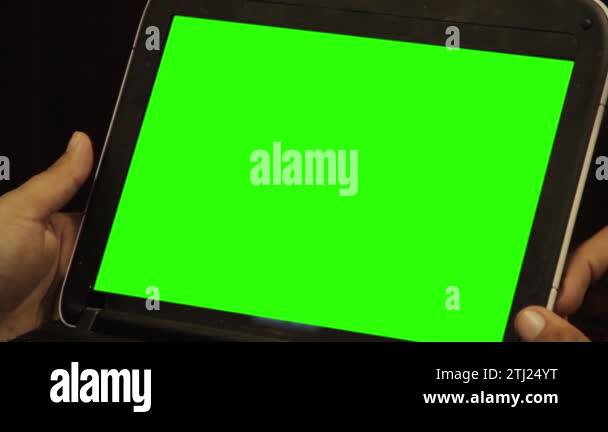 Netbook Computer with Green Screen. Close Up. You can replace green ...