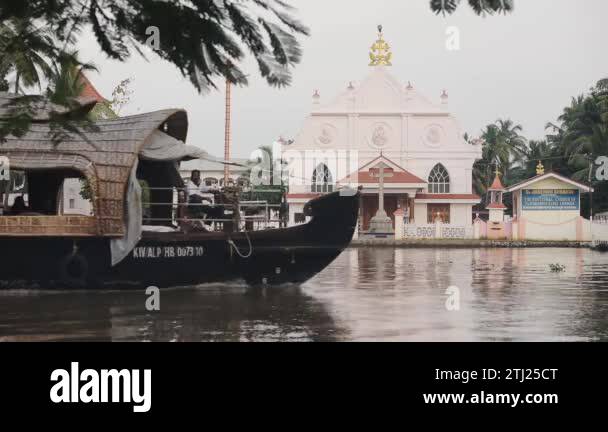 Alleppey curch temple view and an houseboat passing by, Kerala Backwaters, India Stock Video ...