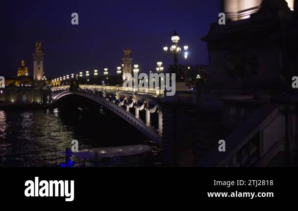 Romantic night scene of Alexandre III bridge across the Seine River in ...