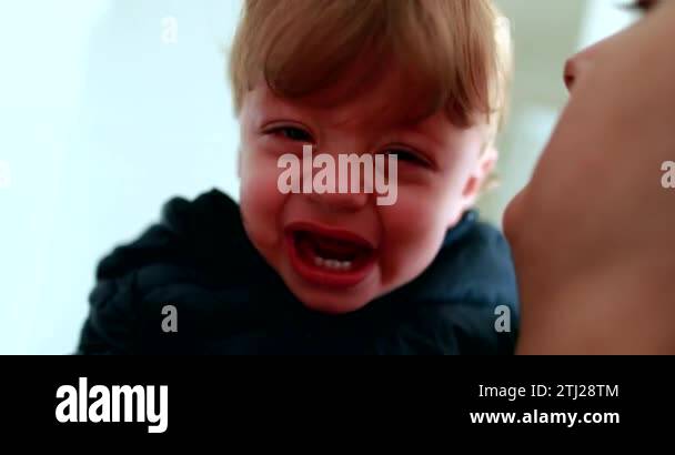 Baby boy having a tantrum crying. Exhausted tired infant child cries ...